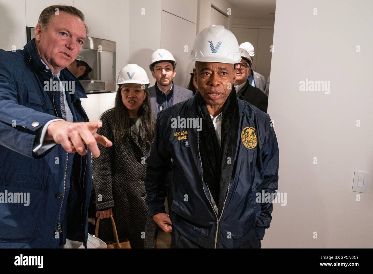 Mayor Eric Adams tours of the former office building being converted to ...