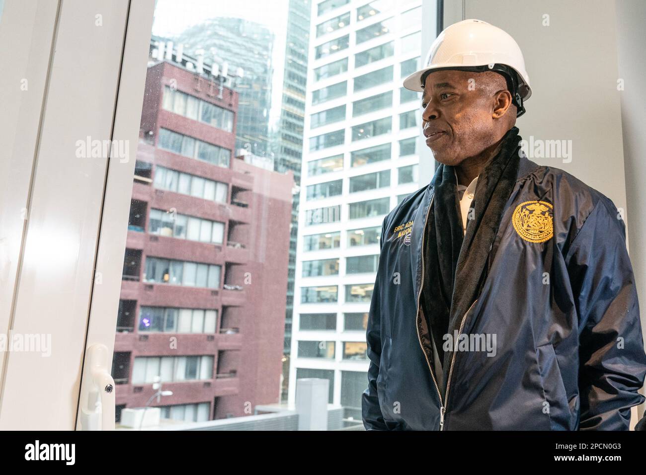 Mayor Eric Adams tours of the former office building being converted to ...