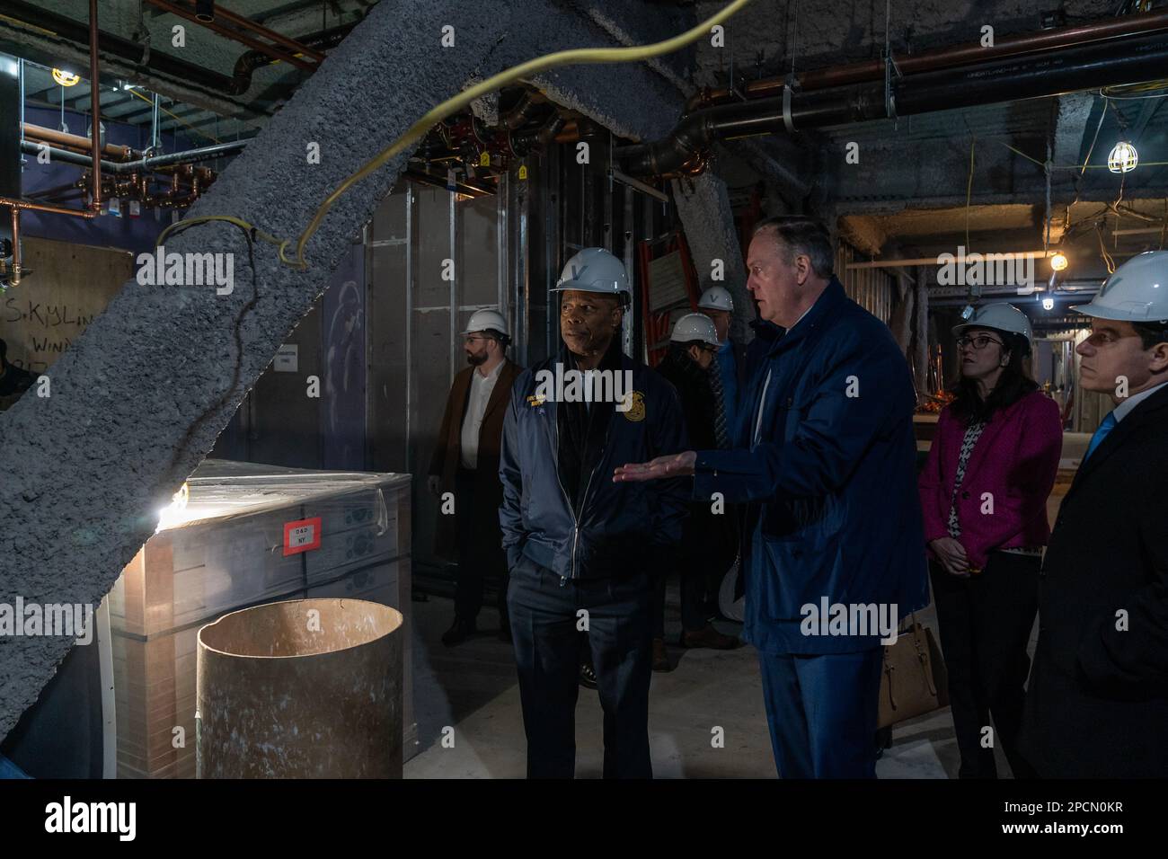Mayor Eric Adams tours of the former office building being converted to ...