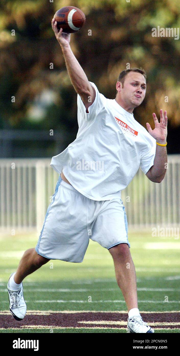 Wyoming quarterback Jacob Doss throws a pass during a voluntary workout ...