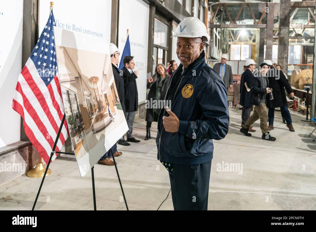 Mayor Eric Adams tours of the former office building being converted to ...