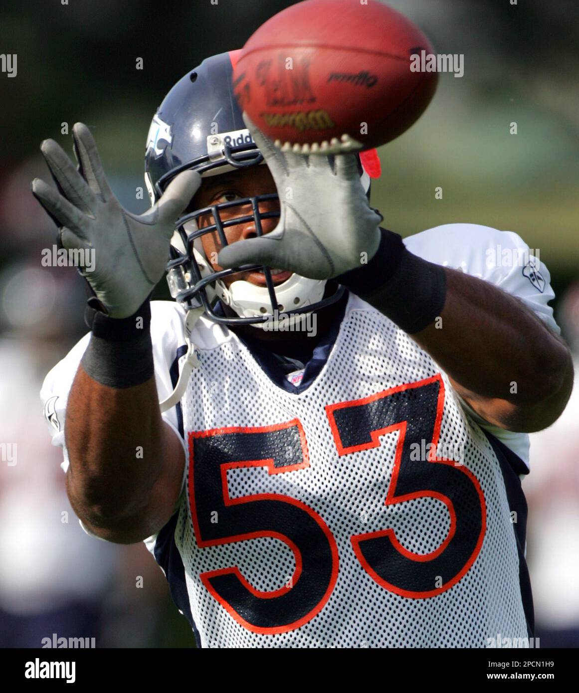 Denver Broncos linebacker Louis Green eyes the ball during a drill in ...