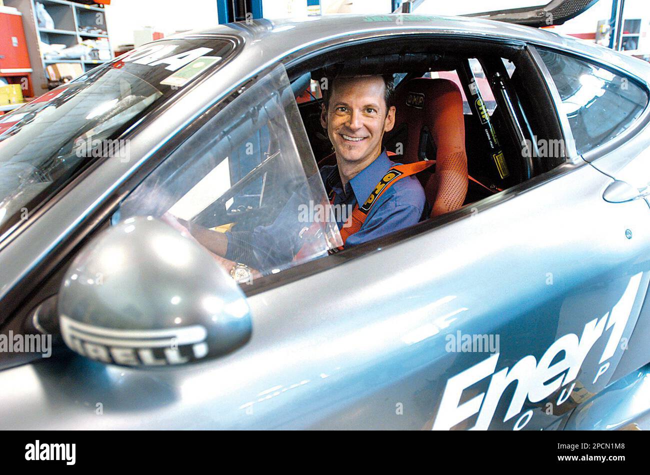 Photographer Jonathan Kendall sits behind the wheel of a Ferrari race ...