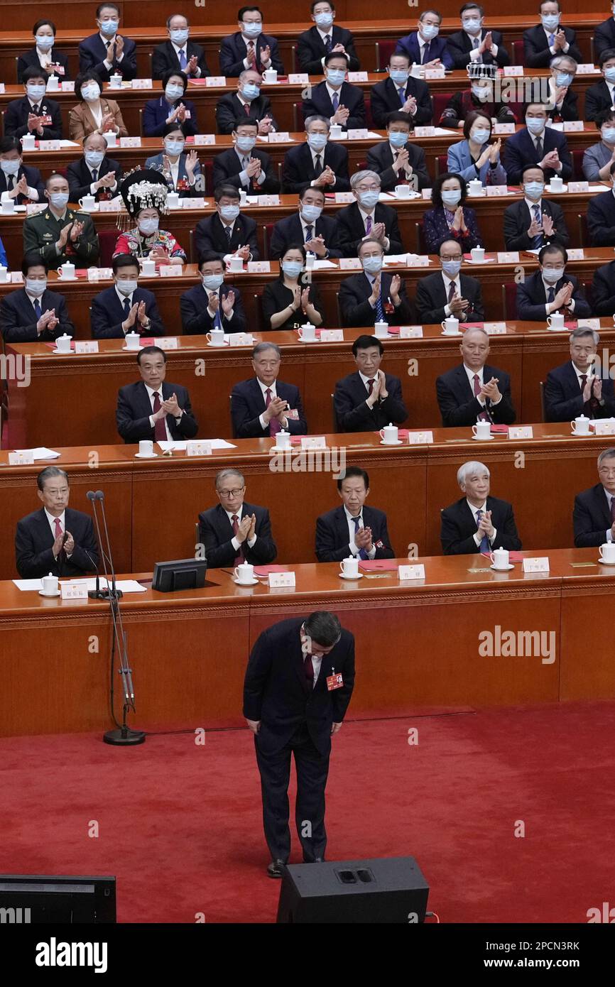 Chinese President Xi Jinping (front) bows before making a speech at the ...