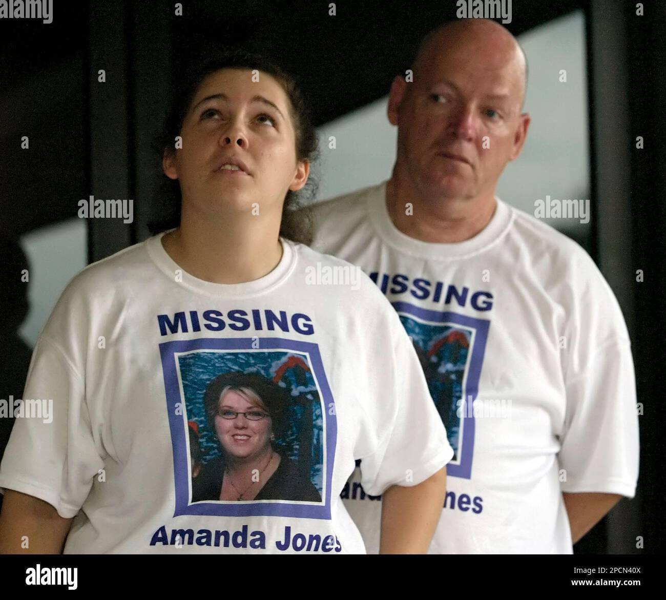 Carrie Johnson looks skyward, as her father Hubert Propst watches, as ...