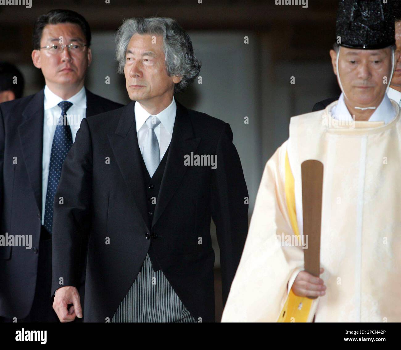 Dressed in a black mourning suit, Japanese Prime Minister Junichiro ...