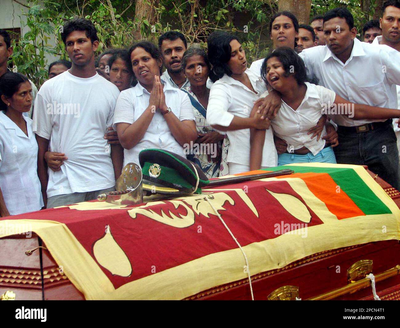 Family members of Sri Lankan army officer Major Daniel Somapala mourn ...