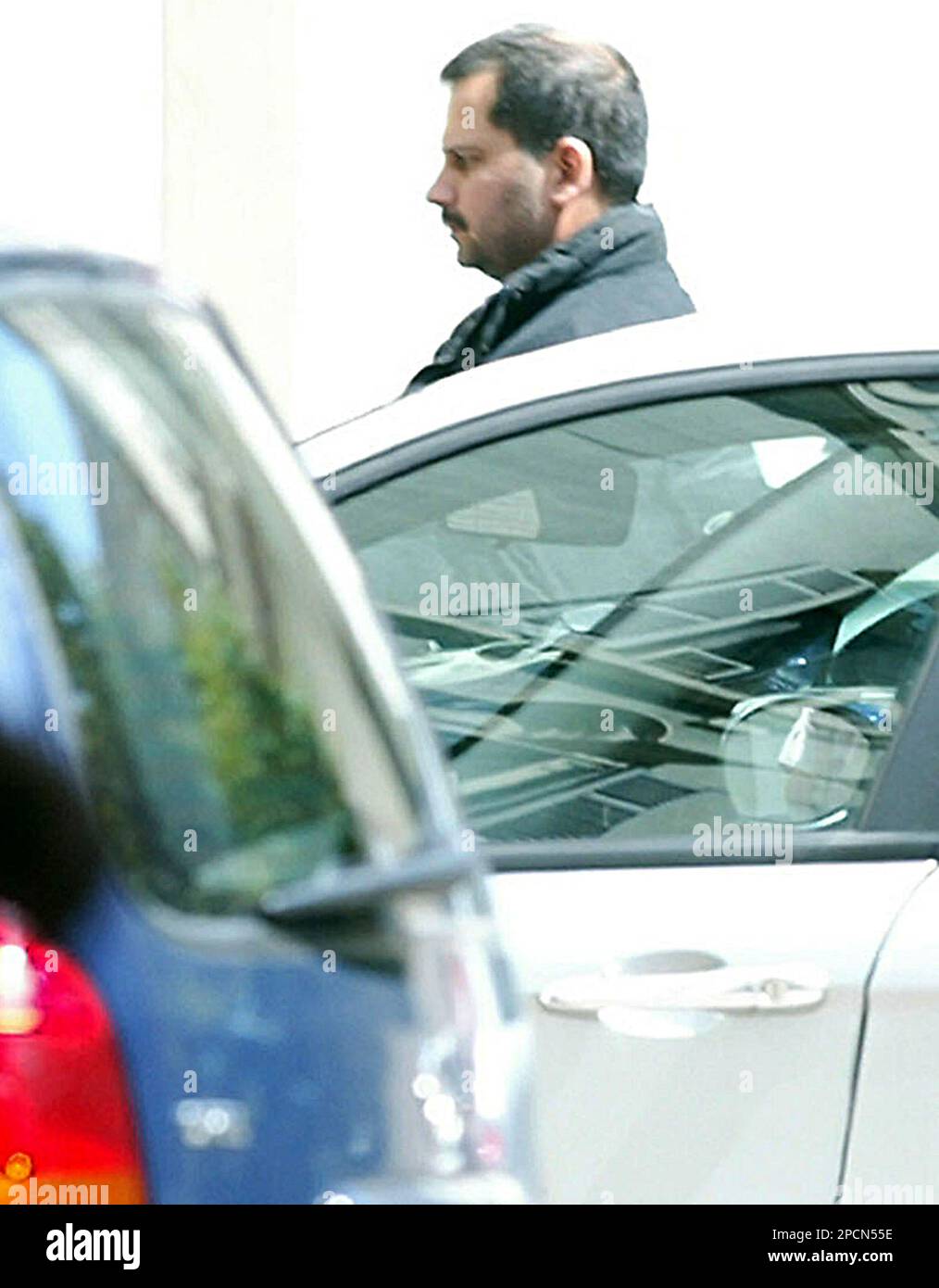 Muhammed Saleem arrives at the police headquarters after being arrested ...