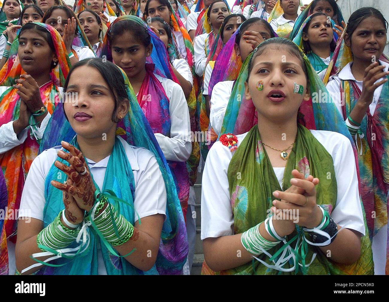 Pakistans school girls wear traditional dresses sing a national song ...
