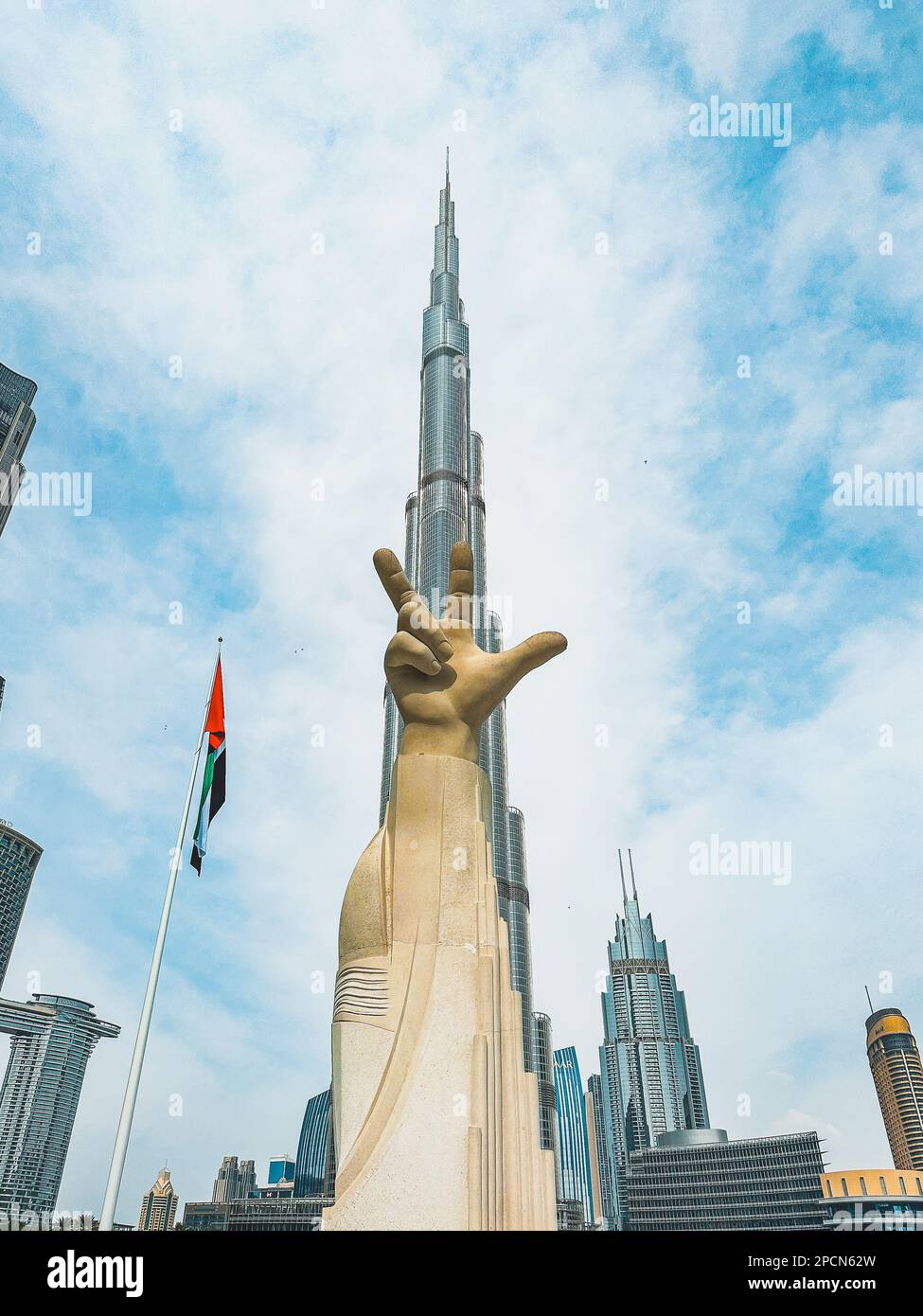 Three Fingers Statue in Burj Park surrounded by skyscrapers in Downtown ...
