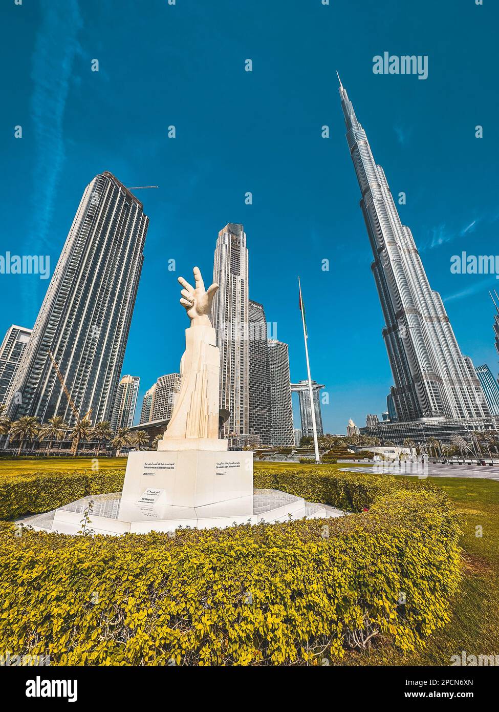 Three Fingers Statue in Burj Park surrounded by skyscrapers in Downtown ...