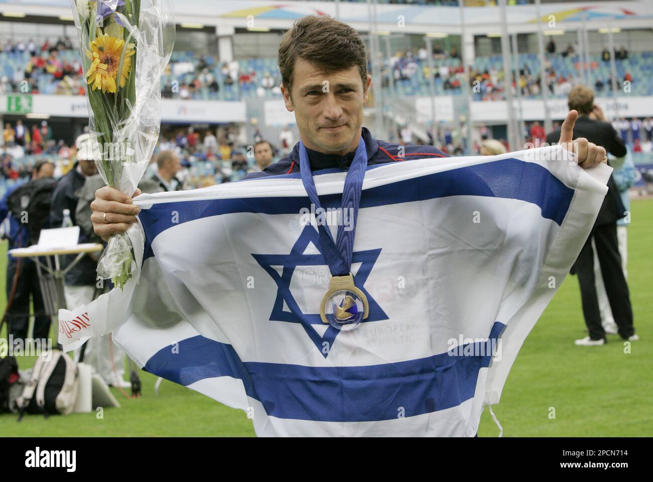 Israel's Alex Averbukh celebrates after receiving his gold medal in the ...