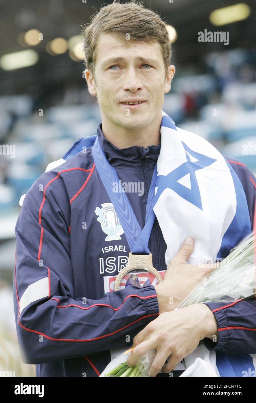 Israel's Alex Averbukh stands with his gold medal forthe Men's Pole ...