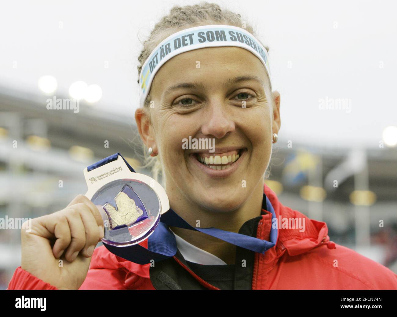 Germany's Steffi Nerius poses with her gold medal for the Women's Javelin, following the ...