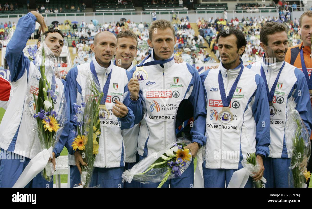 The Italian marathon team pose with their gold medals, following the ...