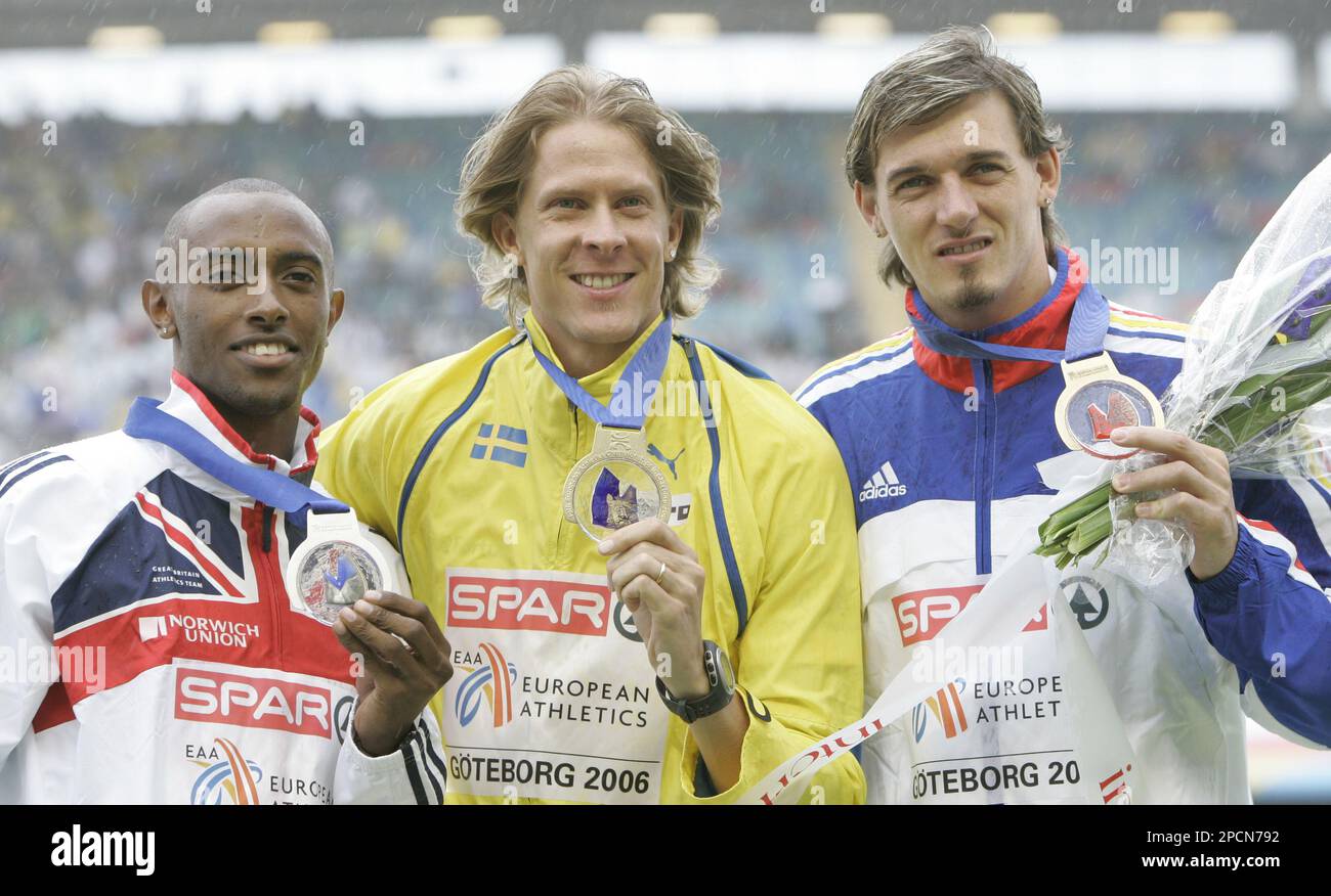 Sweden's Triple Jump gold medalist Chris Olsson is flanked by Britain's ...