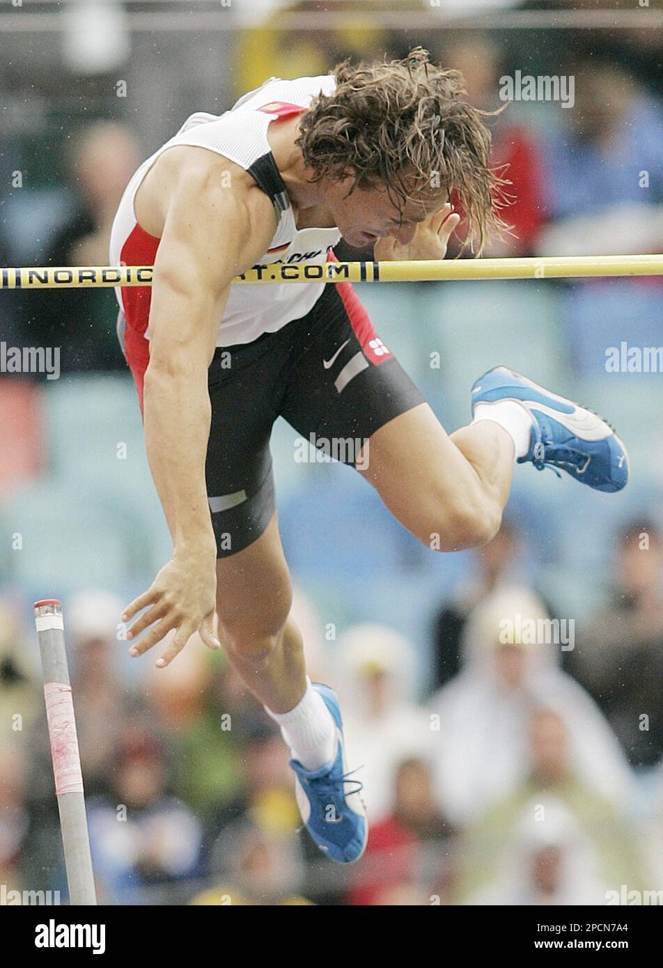Germany's Tim Lobinger clears the bar on his way to winning a silver ...