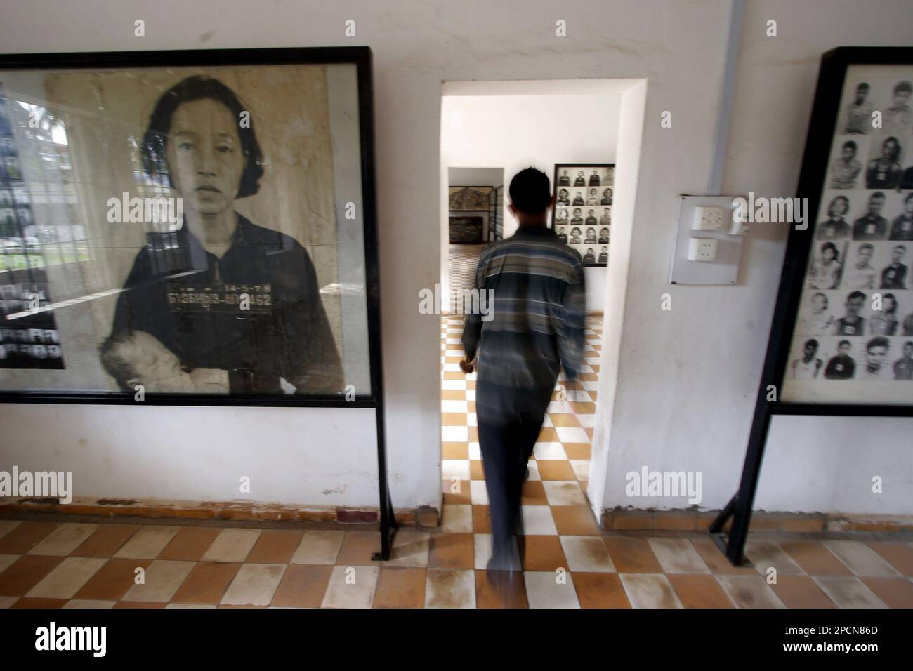 Portraits of those killed by the Pol Pot regime are shown on display at ...