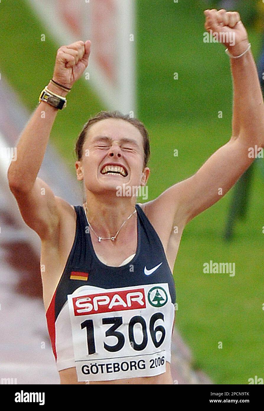 Germanys Ulrike Maisch Reacts As She Crosses The Line To Win The Women