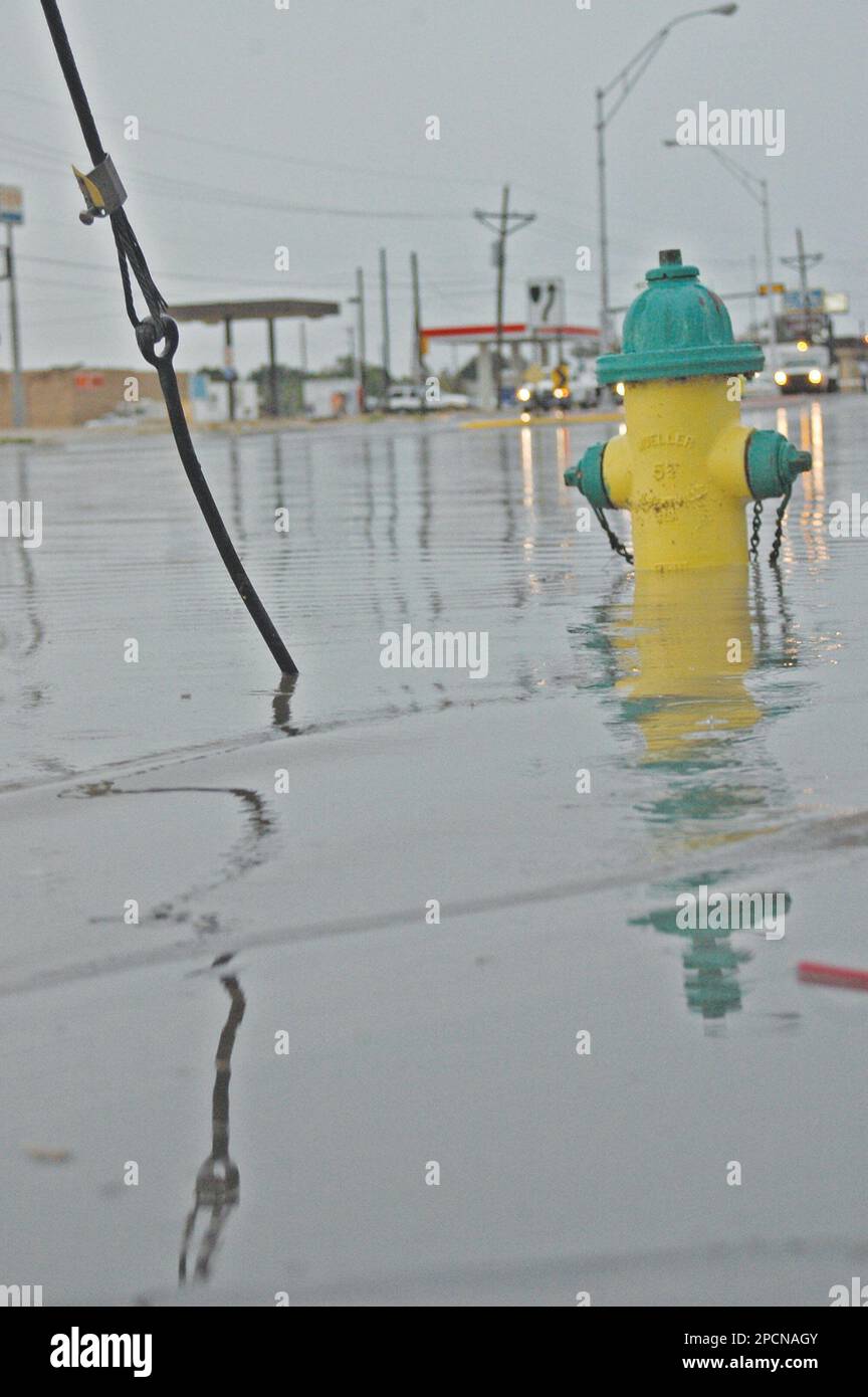 A fire hydrant is seen in high water as heavy rain swept through Hobbs ...