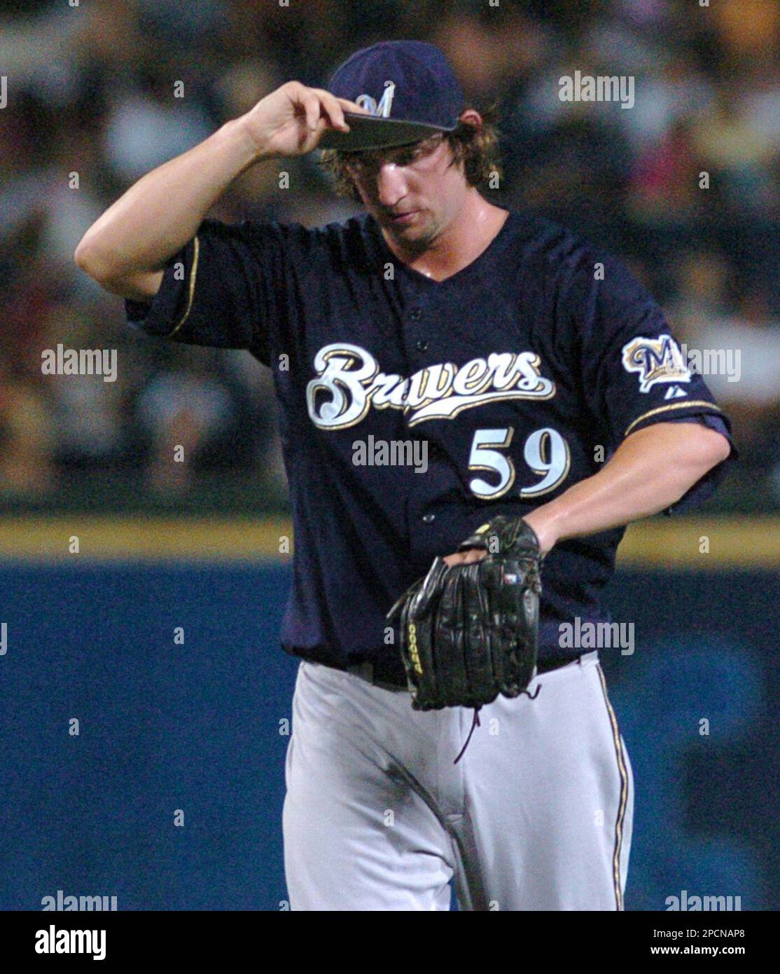 Milwaukee Brewers relief pitcher Derrick Turnbow adjusts his hat as he ...
