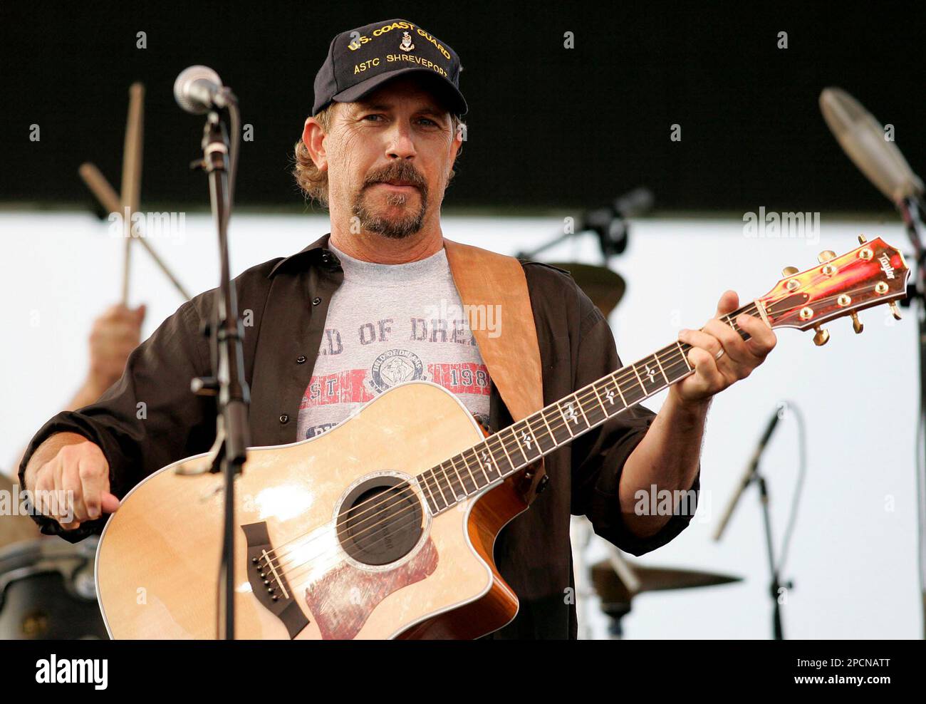 Kevin Costner, the star of the movie Field of Dreams, performs with ...