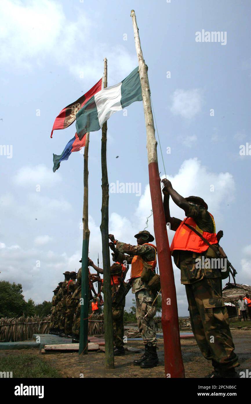Nigerian military lower their flags at the Baro camp in Bakassi ...