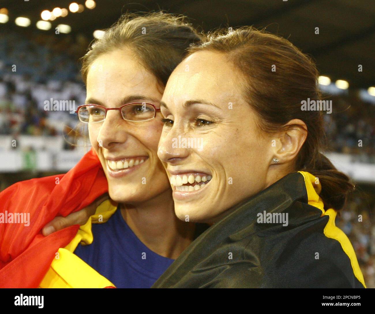 Belgium's Kim Gevaert, right, celebrates winning the gold medal in the ...