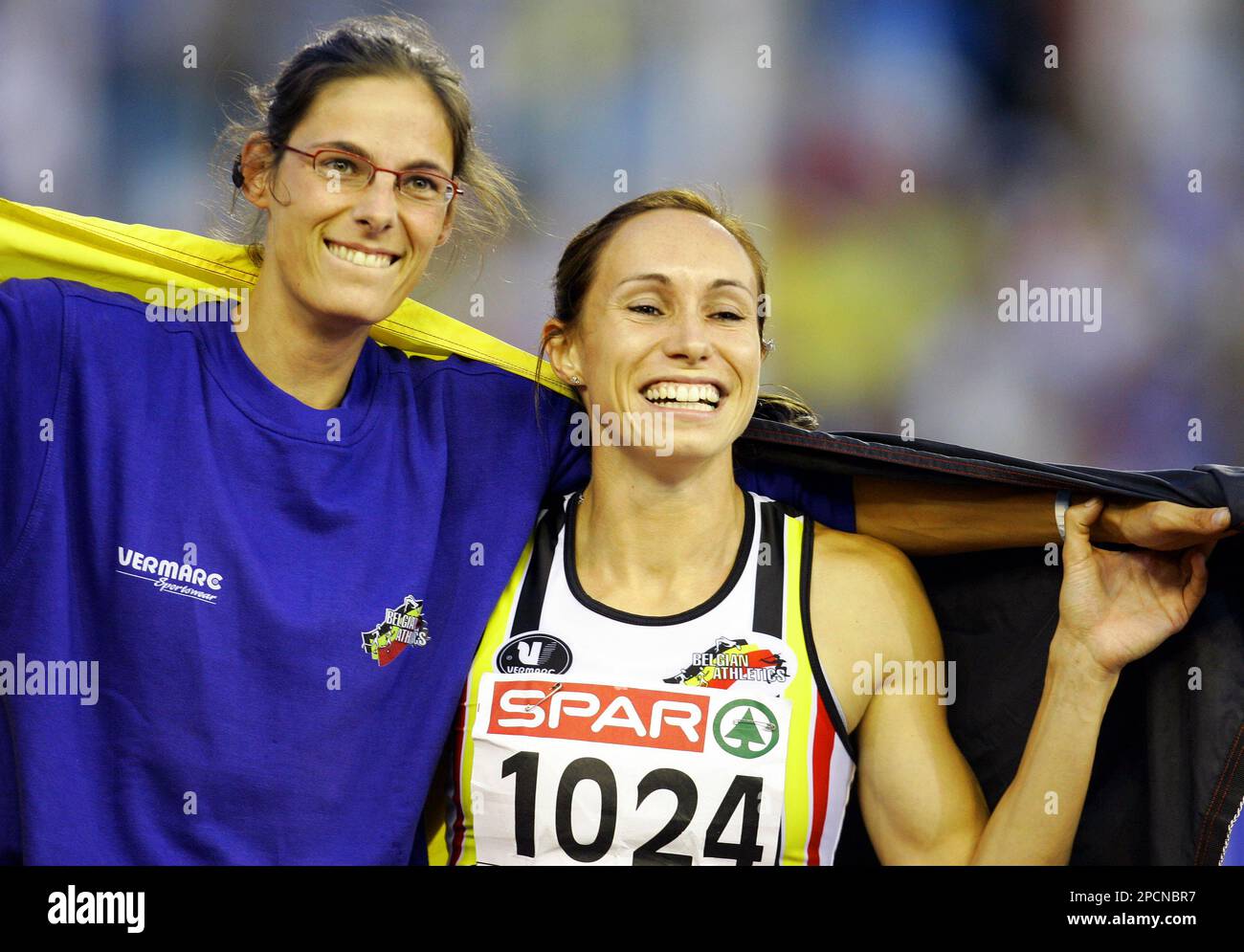 Belgium's Kim Gevaert, right, celebrates winning the gold medal in the ...
