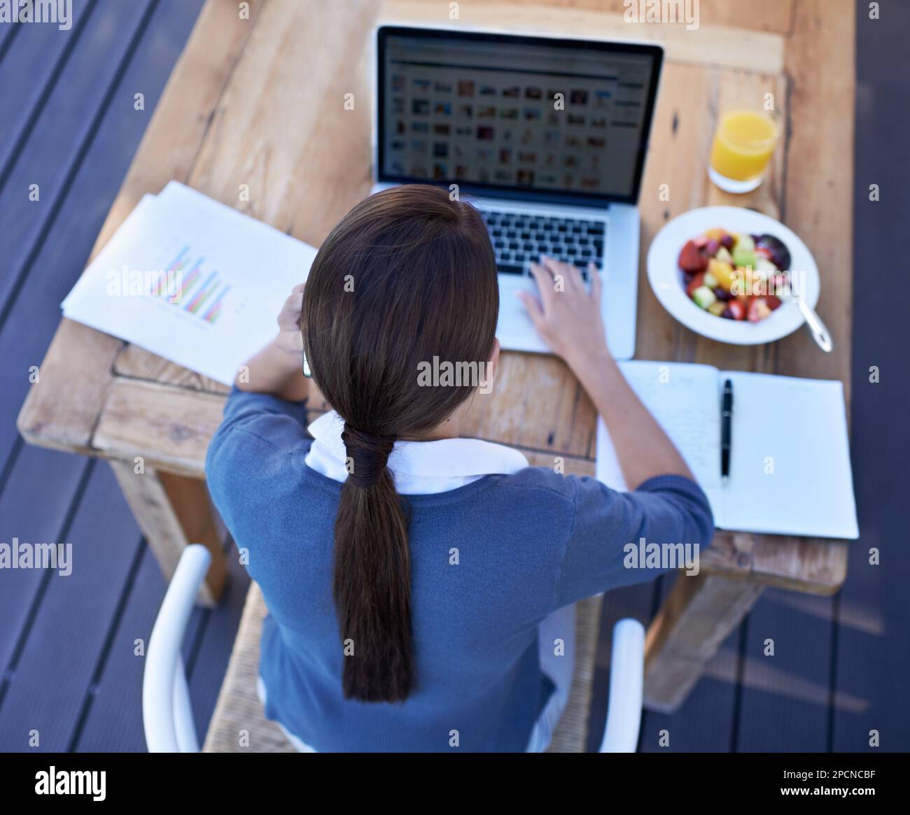 Researching for her next assignment. An attractive young woman using ...