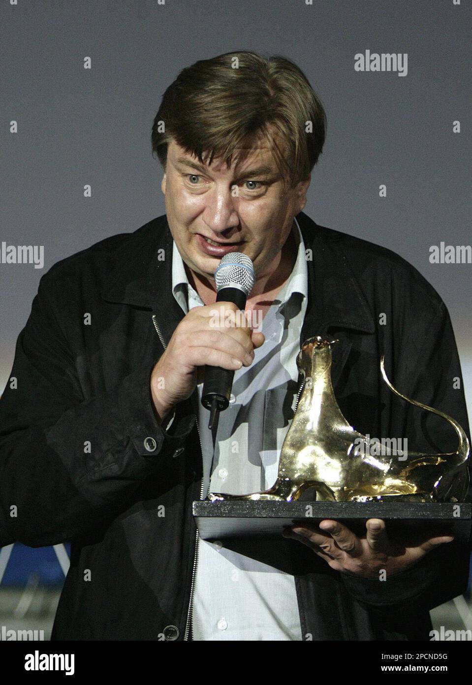 Finnish filmmaker Aki Kaurismaeki greets the audience on the stage of ...