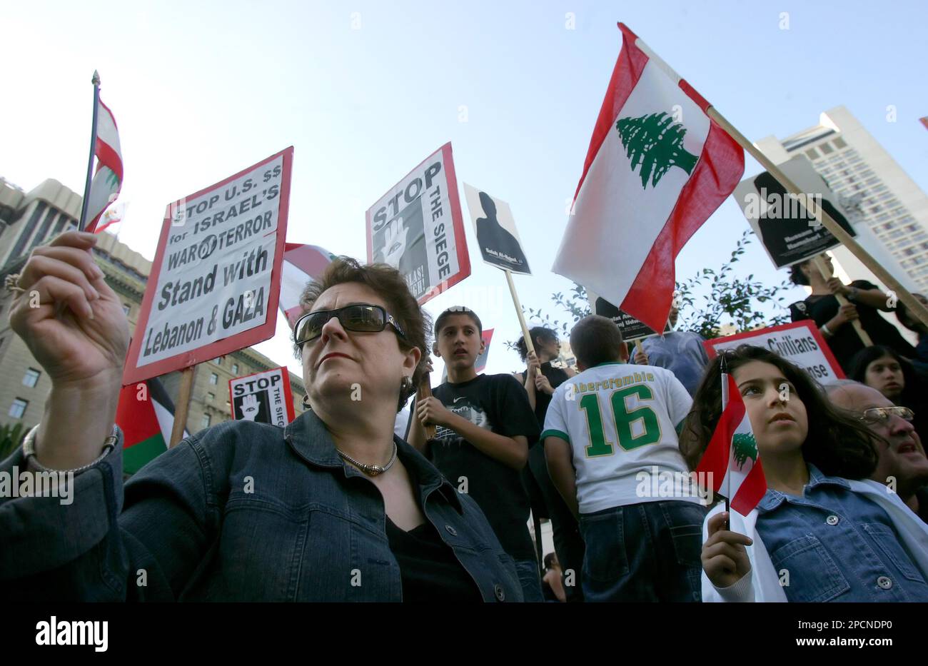 Najat Nicola, left, and her niece Yasmina Malouf, 5, lower right, hold ...