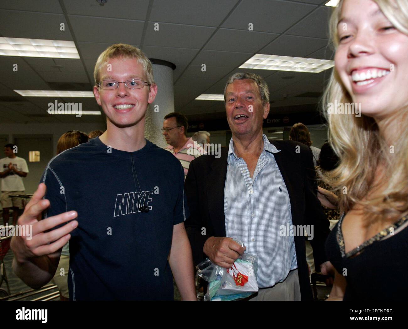 Geoff Wright, center, is flanked by his son Chris, left, and daughter ...