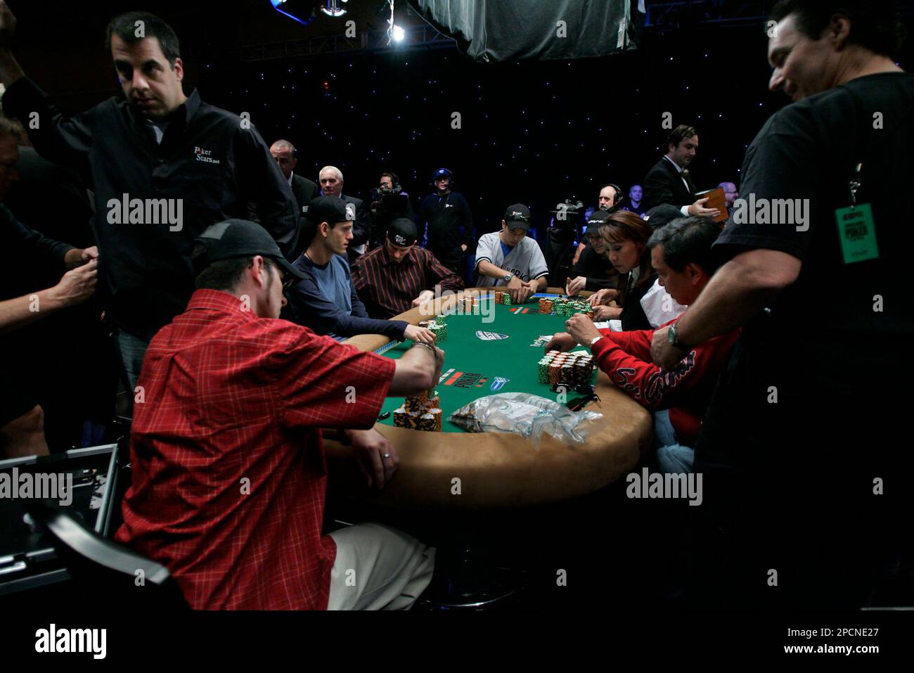 Dan Nassif, left standing, has his microphone put on just before ...