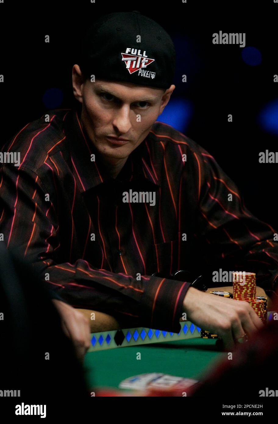 Michael Binger, of Atherton, Calif., looks up while playing a hand at ...