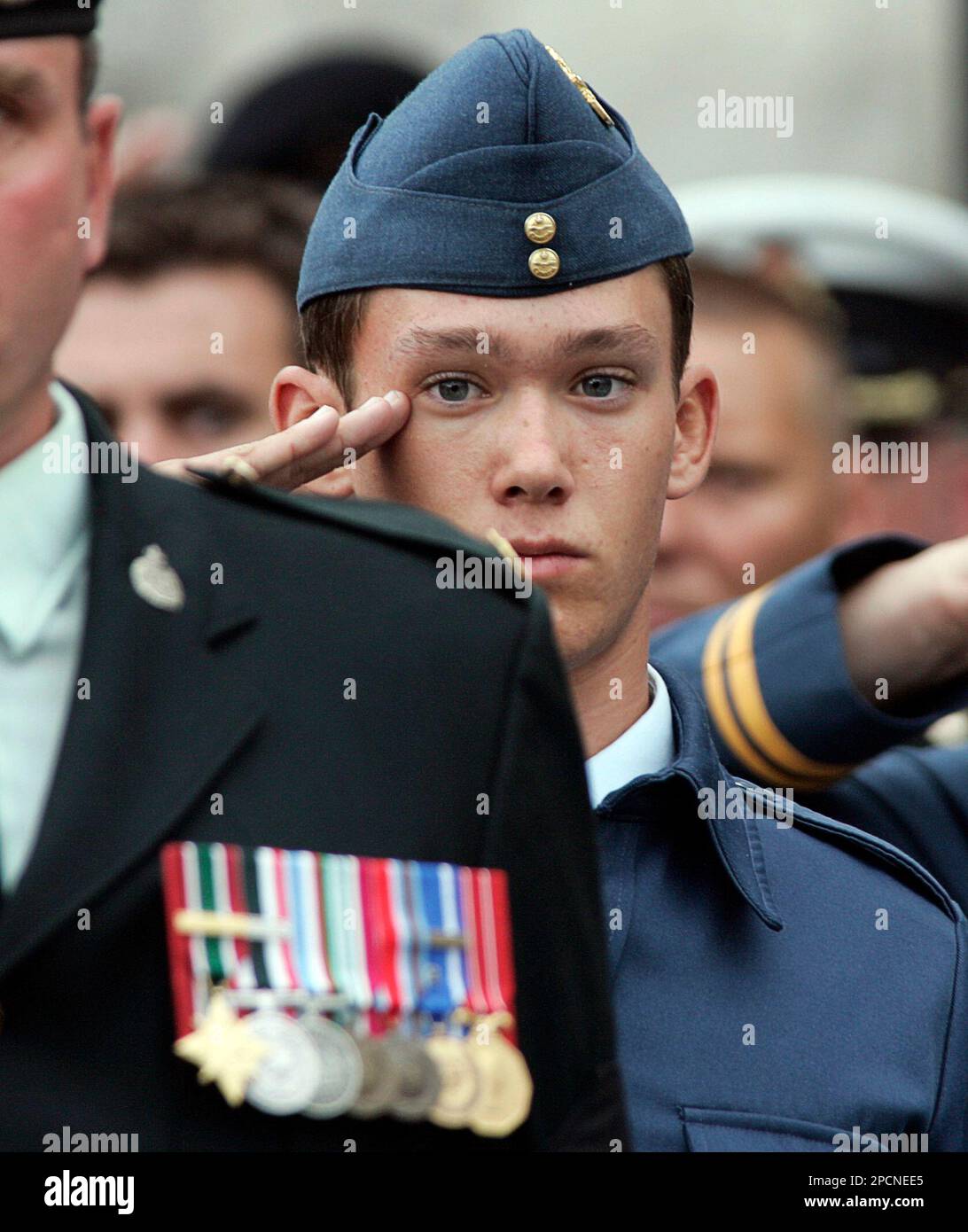 Jonah Rosson salutes his stepfather Maj. Paeta Derek Hess-von Kruedener ...