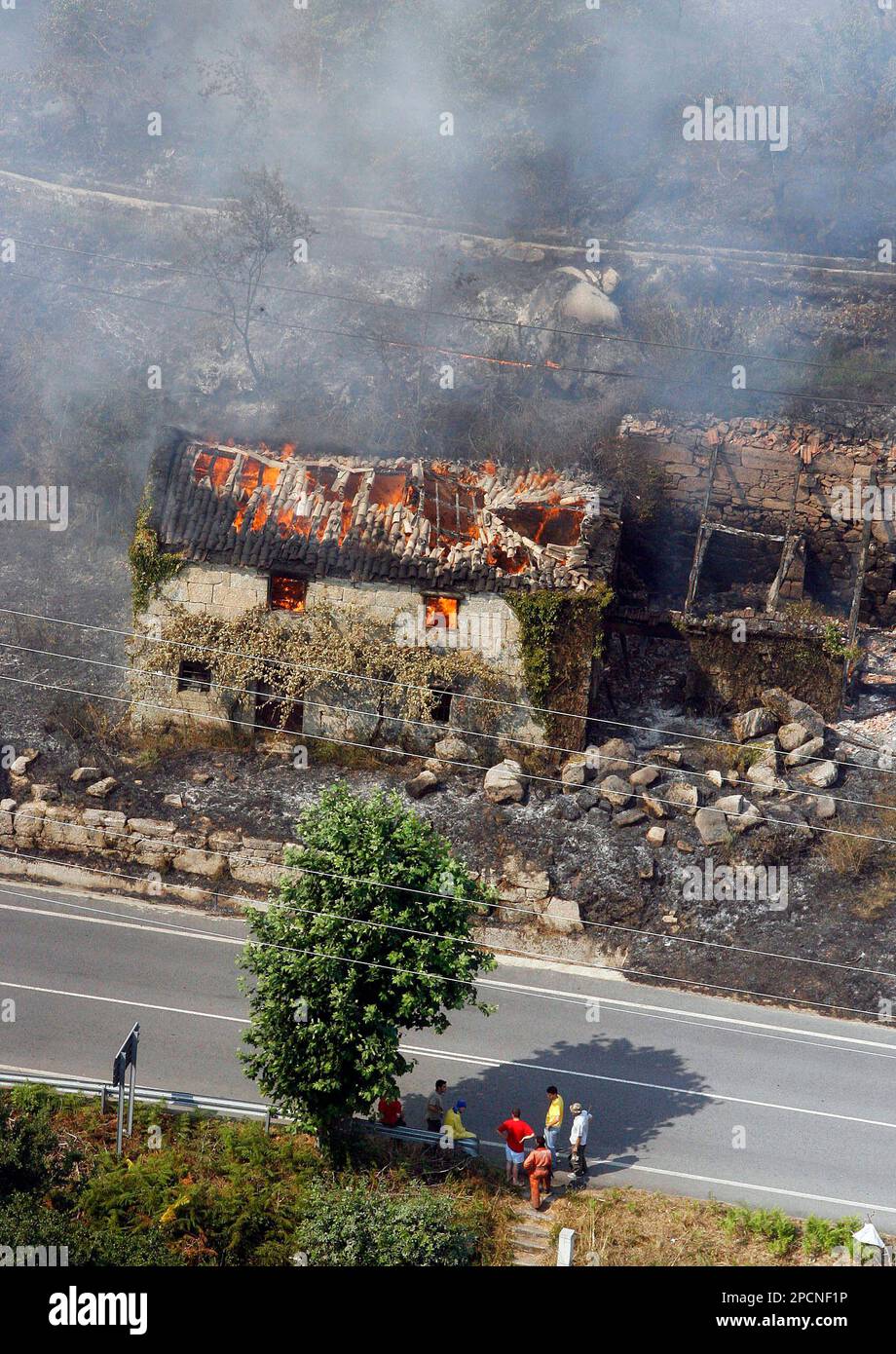 An aerial view shows the damage after a forest fire near the Galician ...
