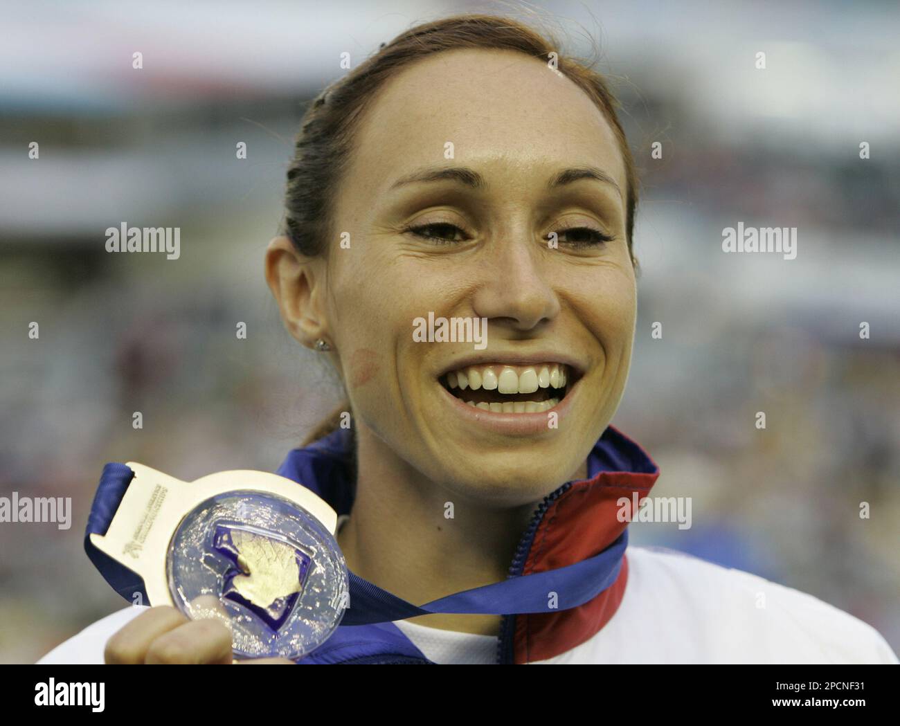 Belgian Women's 100 meter gold medal winner Kim Gevaert poses with her ...