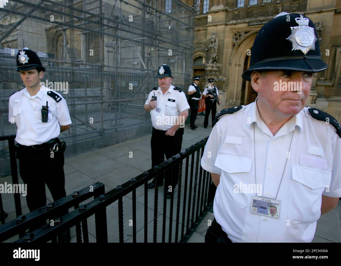 British police officers stand guard outside the Houses of Parliament in ...