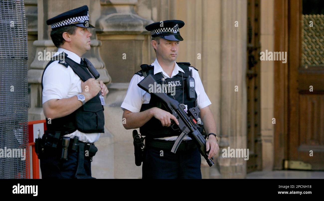 British police officers stand guard outside the Houses of Parliament in ...