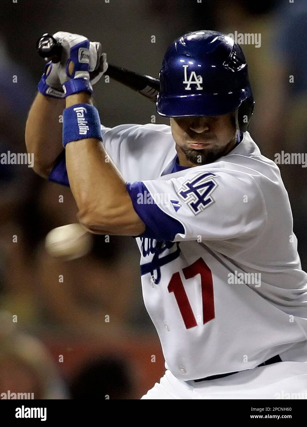 Los Angeles Dodgers' Jason Repko is hit on the elbow by a pitch from ...
