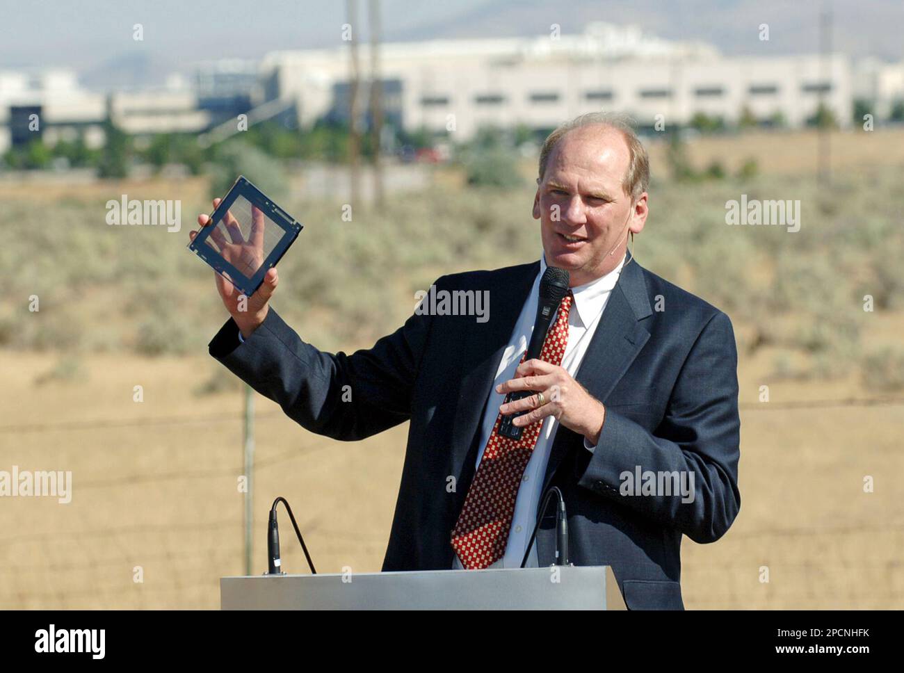 Micron Technology Inc. CEO Marc Durcan displays a photomask at the ...