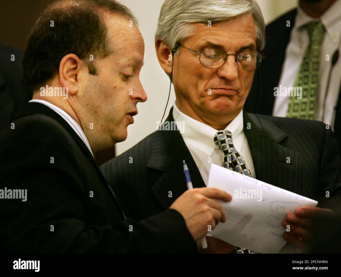 Defendant Perry March, left, talks with his attorney, William Massey ...