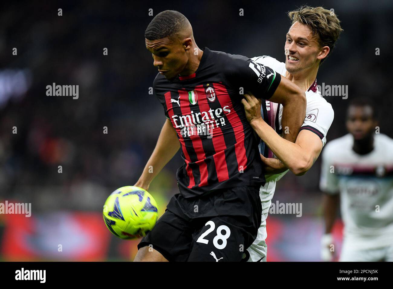 Milan, Italy. 13th Mar, 2023. AC Milan's Malick Thiaw (L) vies with ...