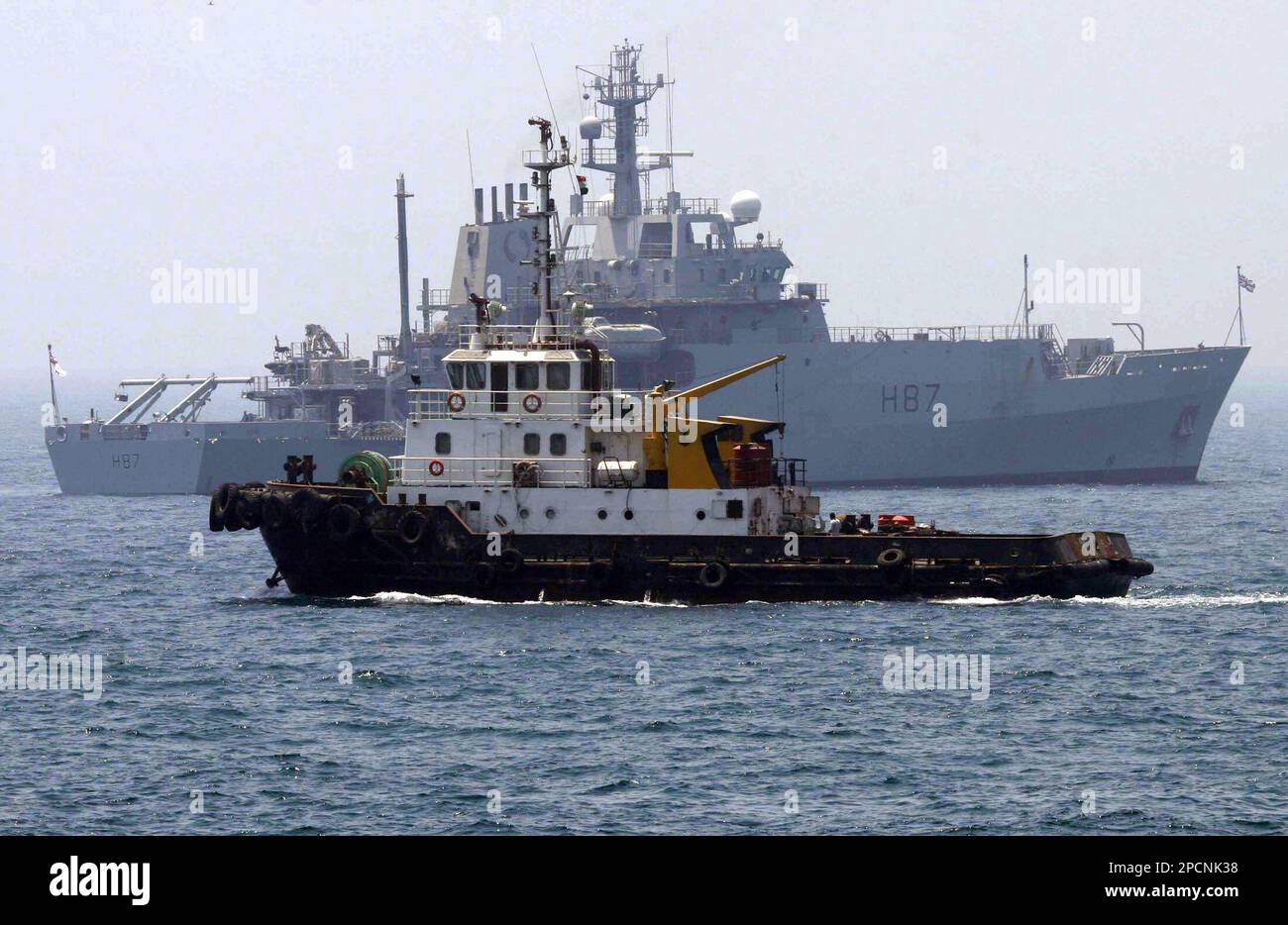 An Iraqi Iraqi boat passes by the Echo, one of the Britain Royal Navy's ...