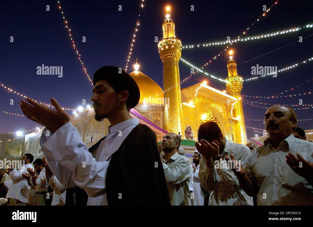 Iraqi Shiite Muslims pray on the birth anniversary of Imam Ali, cousin ...