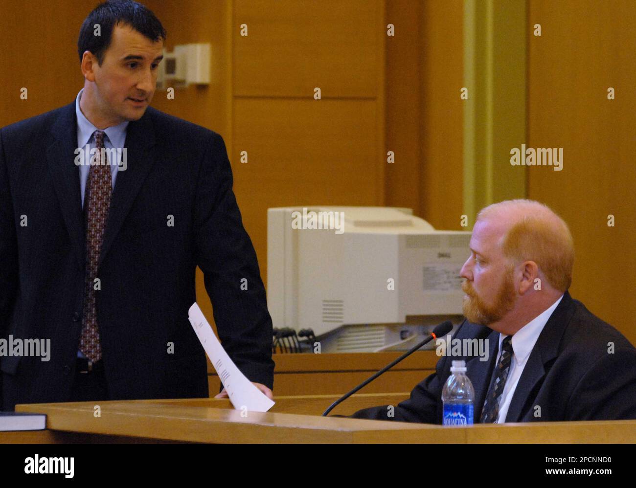 Defense witness John Polster, right, is cross examined by assistant ...