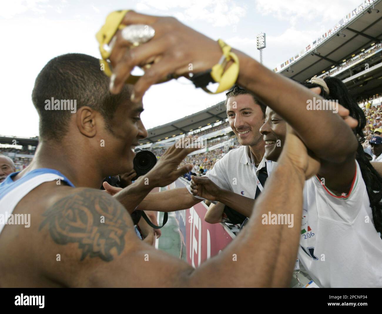 **ADDING NAME OF HOWE MOTHER**Italy's Andrew Howe is congratulated by ...
