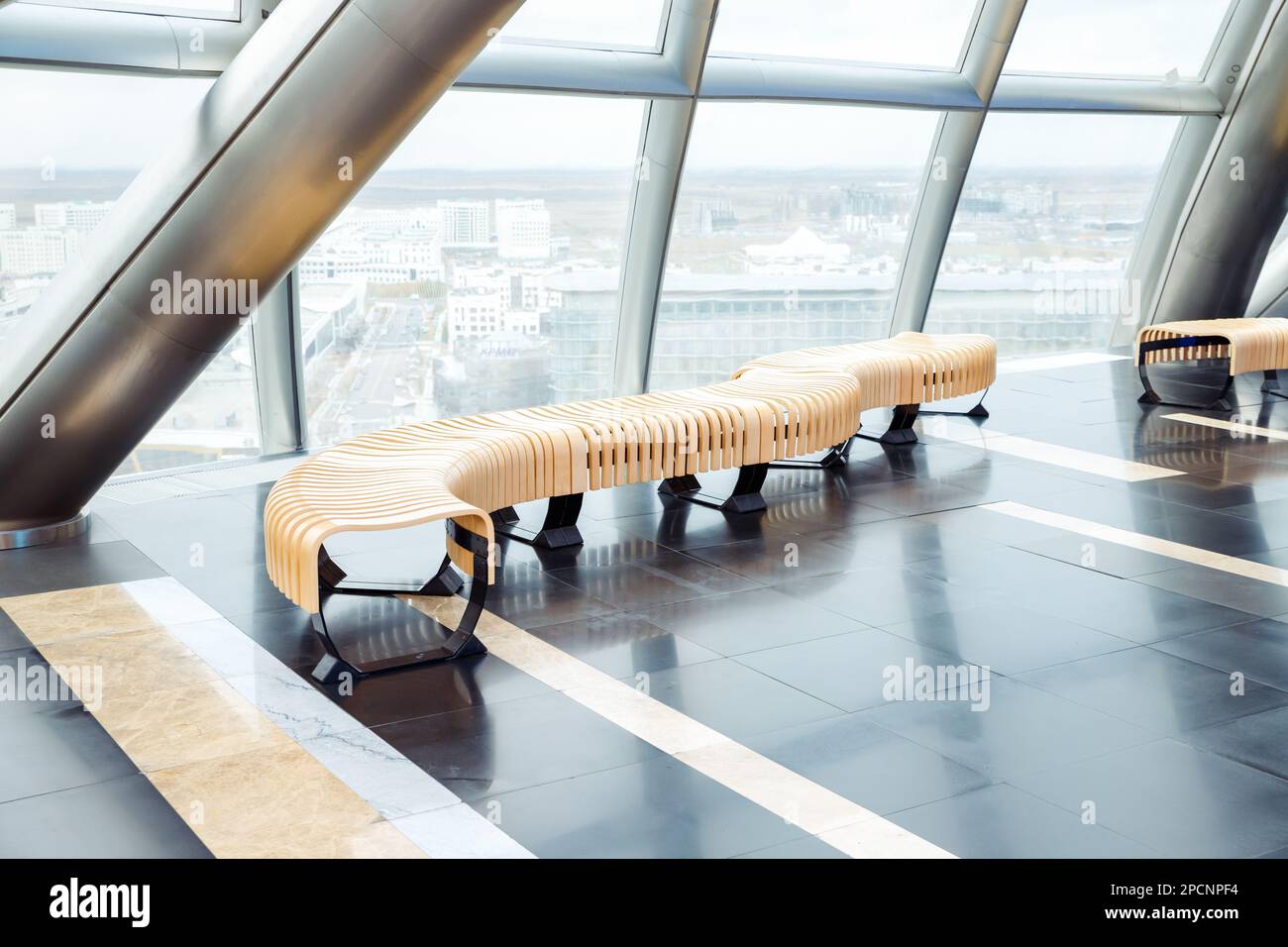 bench in modern office building, panoramic windows, metal structures ...