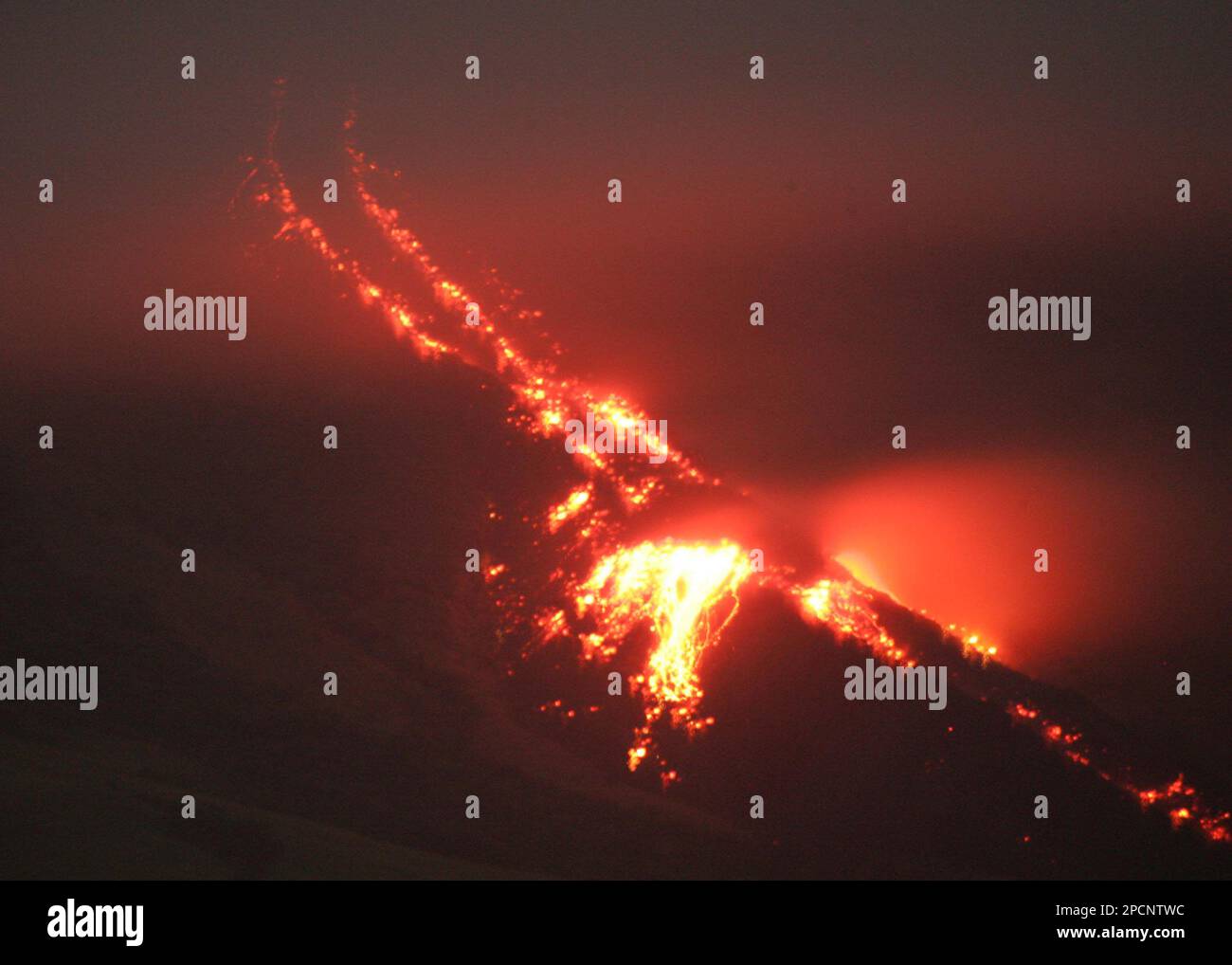 Lava cascades down the slopes of Mayon volcano in its continuing "mild ...